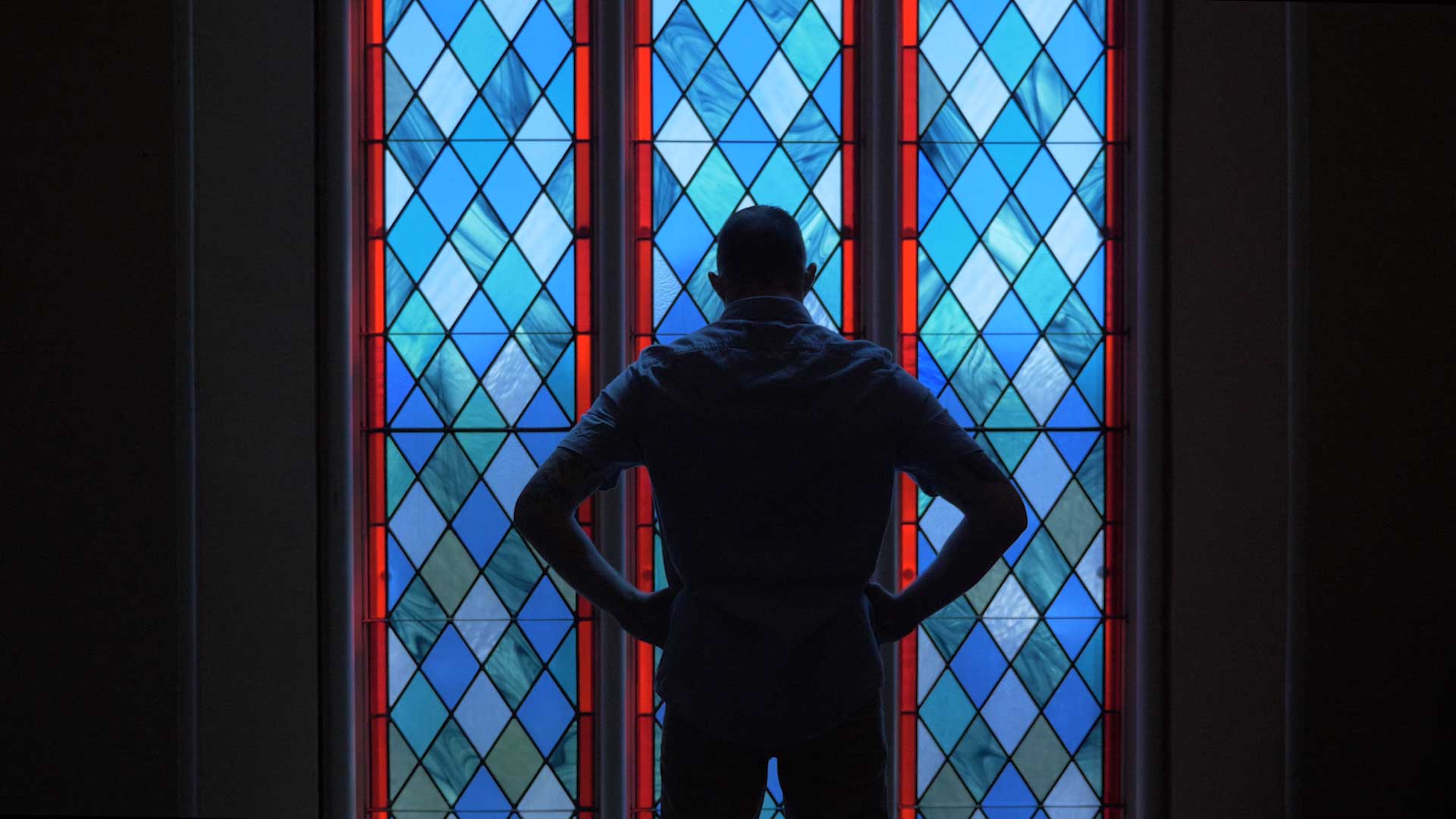 Man Standing at Stained Glass Window – FILMPAC